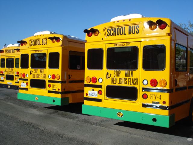 District’s hybrid buses parked over green rub rails | School Bus Fleet